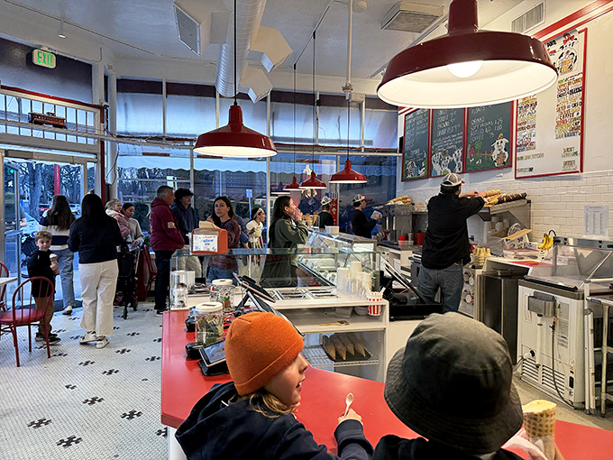 The line inside moves with surprising efficiency&mdash;a choreographed dance of scoopers and customers united in pursuit of frozen happiness.