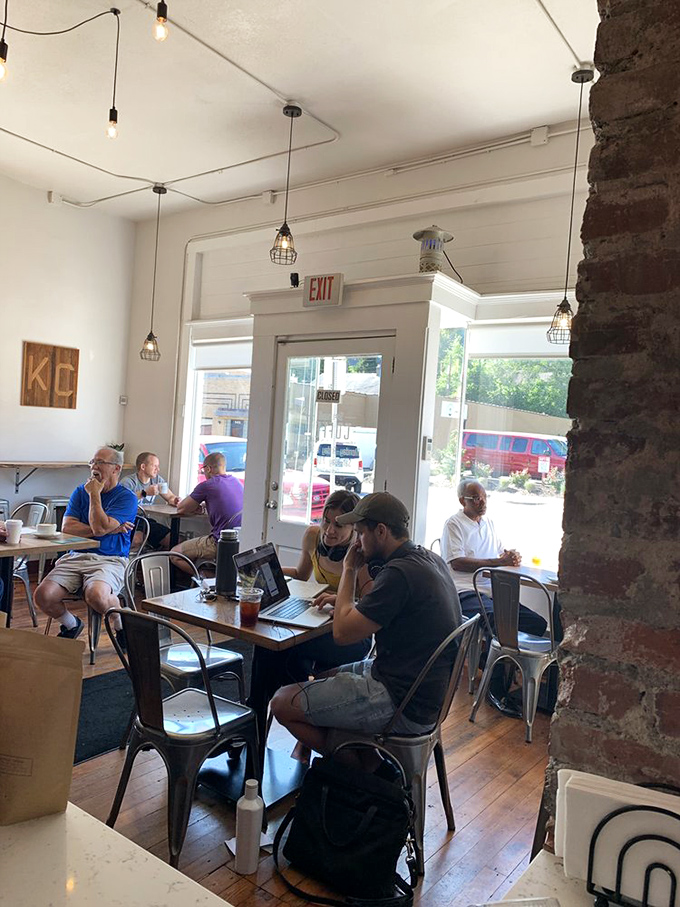 The true measure of a coffee shop: people lost in conversation, laptops forgotten, and not a single person checking the time.