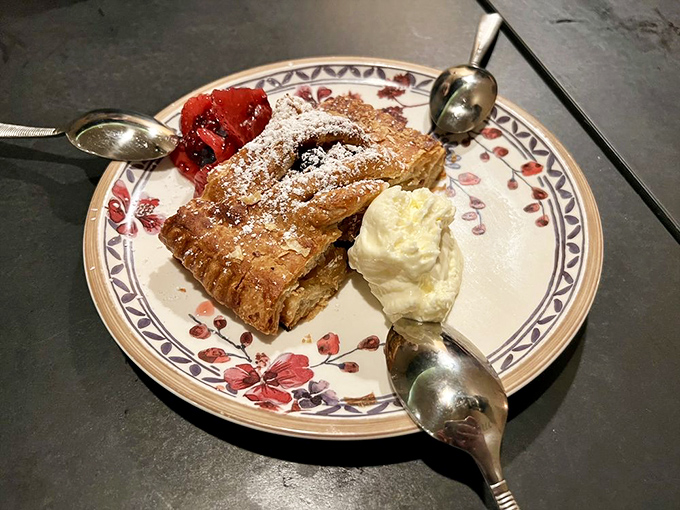 A dessert that whispers "resistance is futile" as it sits innocently on a flower-patterned plate, making diets vanish and memories form with each sweet bite.