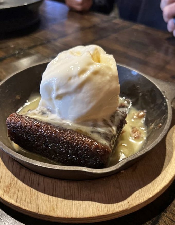 This dessert doesn't just end the meal&mdash;it crowns it. That ice cream melting into warm cake creates a moment of pure, fleeting perfection.