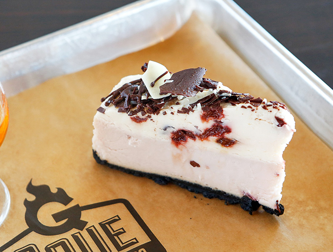 Cheesecake that knows its role in the grand finale of your barbecue opera. A sweet, creamy curtain call that somehow finds room in your meat-filled stomach.