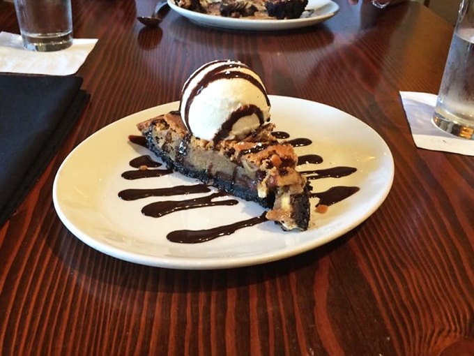 The Toll House pie in its final moments&mdash;warm chocolate decadence meeting cool vanilla ice cream in a dessert romance that was always meant to be.