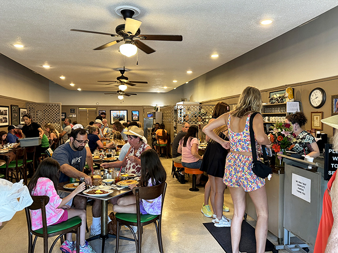 The breakfast rush—where strangers become temporary neighbors united by the universal language of "pass the syrup, please."