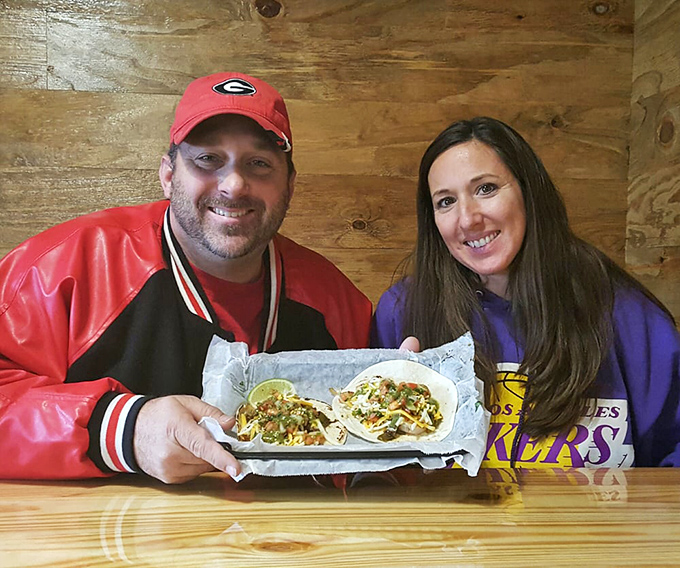 The universal expression of taco happiness knows no boundaries. These diners are experiencing what philosophers call "peak contentment."