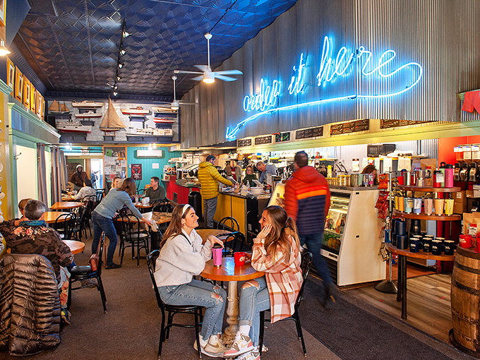 Under the glow of "coffee is here" neon, strangers become neighbors and regulars become family in this Petoskey gathering spot.