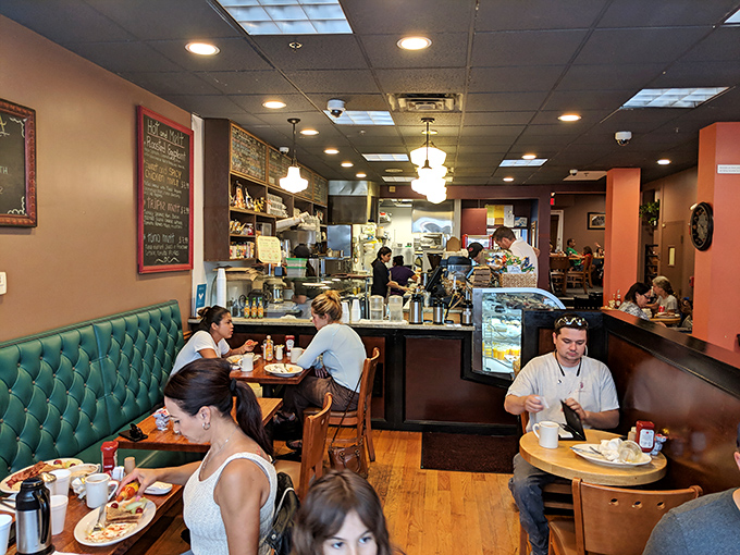 The bustling interior reveals the truth: when locals willingly wait for a table on weekend mornings, you've found the real deal.