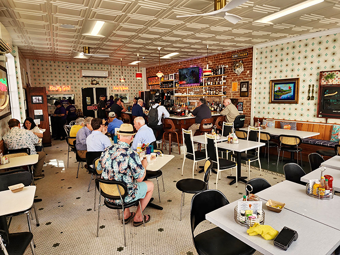 The dining room hums with the energy of regulars and newcomers alike, all united in the universal language of "pass the hot sauce."