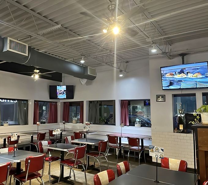 Empty tables waiting for the next wave of breakfast enthusiasts. Those red chairs have held some of Atlanta's happiest, most satisfied bottoms.
