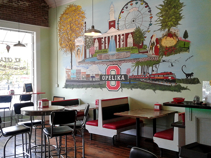 That mural isn't just decoration; it's a love letter to Opelika, complete with trains and local landmarks that root this sweet spot in its community.