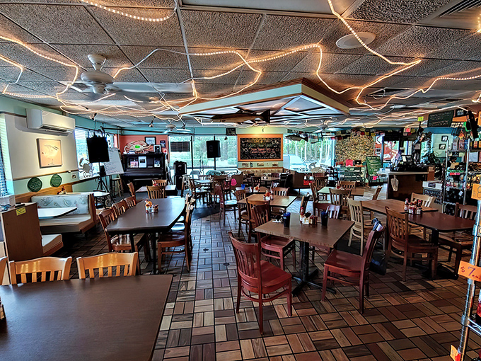 Empty tables waiting for the lunch rush like blank canvases before a masterpiece. The ceiling lights mimic the twinkling surface of the nearby bay.