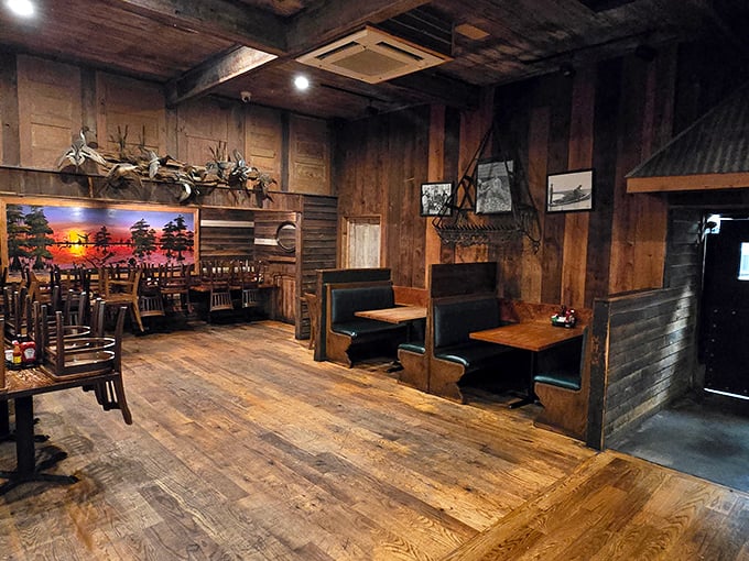 Booths and tables arranged for serious eating business. The worn wooden floors have supported countless happy diners on their way to seafood bliss.