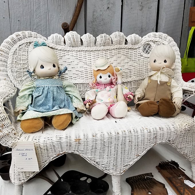 The wicker bench trio &ndash; Precious Moments dolls having what appears to be the world's most innocent and adorable tea party.