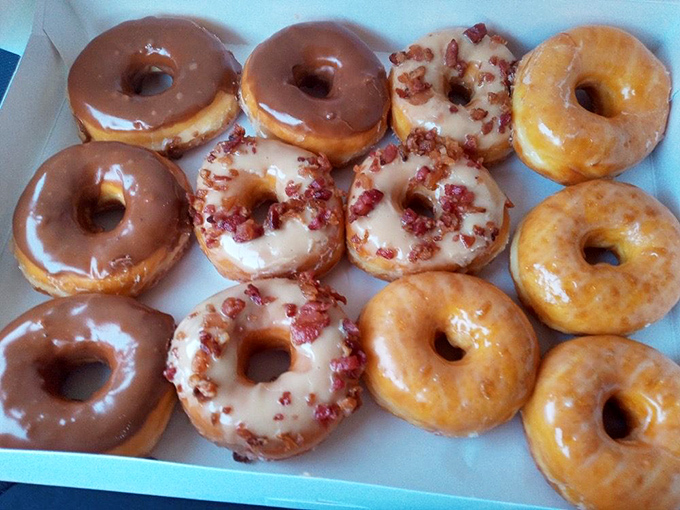 A dozen glazed donuts with their maple and bacon-topped cousins. Breakfast of champions or dessert? Why choose when you can have both?