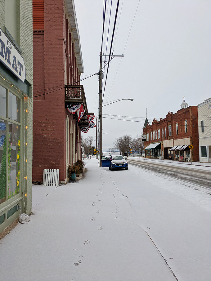 Even under winter's blanket, Nauvoo's main street maintains its charm. Those footprints in snow tell stories of modern visitors exploring this historical treasure.