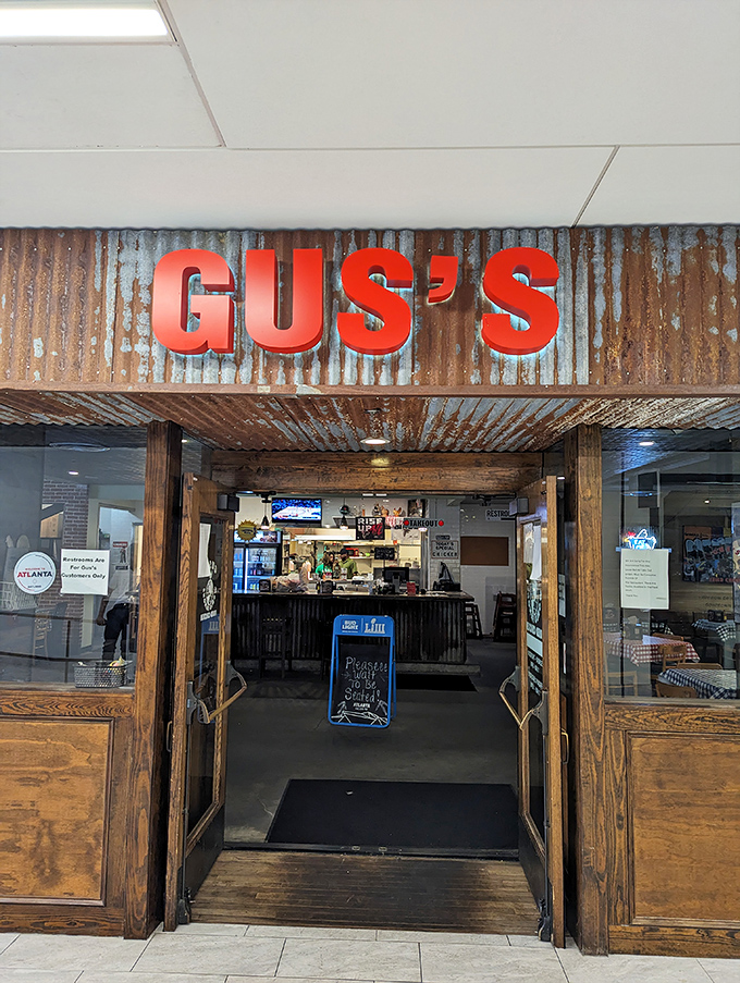 The entrance to chicken nirvana. That rustic corrugated metal and bold red lettering promise authentic flavor without pretense.