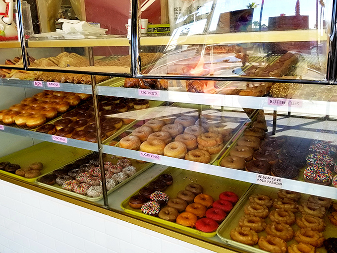 Feast your eyes on this donut dreamland! It's like Willy Wonka opened a bakery, minus the unsettling Oompa Loompas.