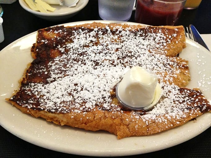 French toast that's crossed the line from breakfast to dessert, dusted with powdered sugar like the first perfect snowfall of a New England winter.