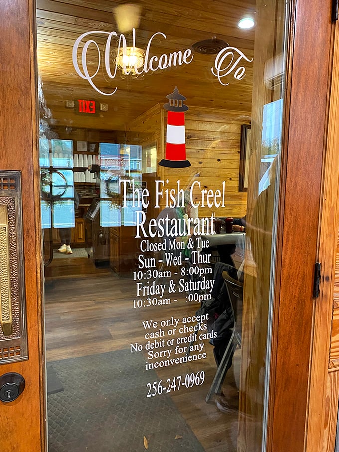 The door tells the story&mdash;lighthouse logo, cash-only policy, and hours that say "we're worth planning your week around."