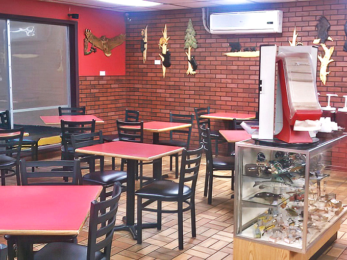 Red tabletops, brick walls, and wooden wildlife mounts&mdash;the classic BBQ joint trifecta that signals you're about to eat something memorable.