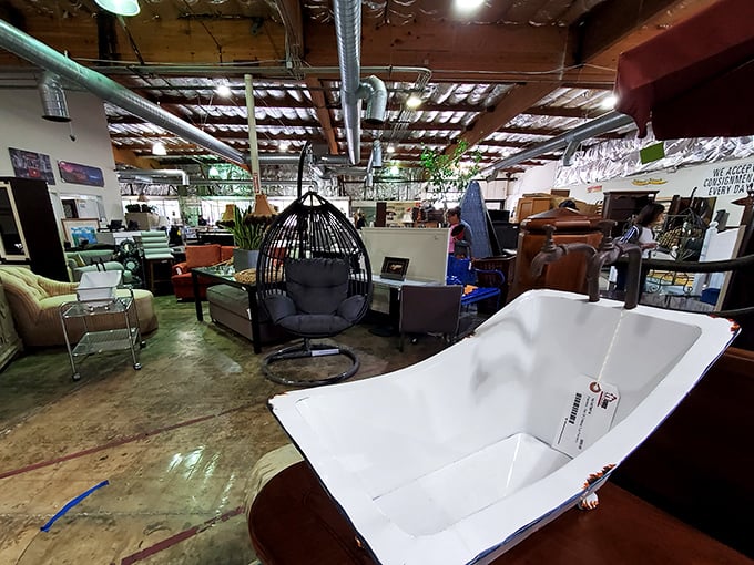 The ultimate "expect the unexpected" moment: a freestanding bathtub and egg chair sharing space like old friends with completely different personalities.