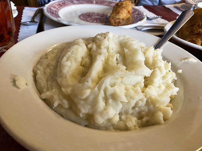 Mashed potatoes so perfectly whipped they could probably solve world peace if we just sat down and shared a bowl together.