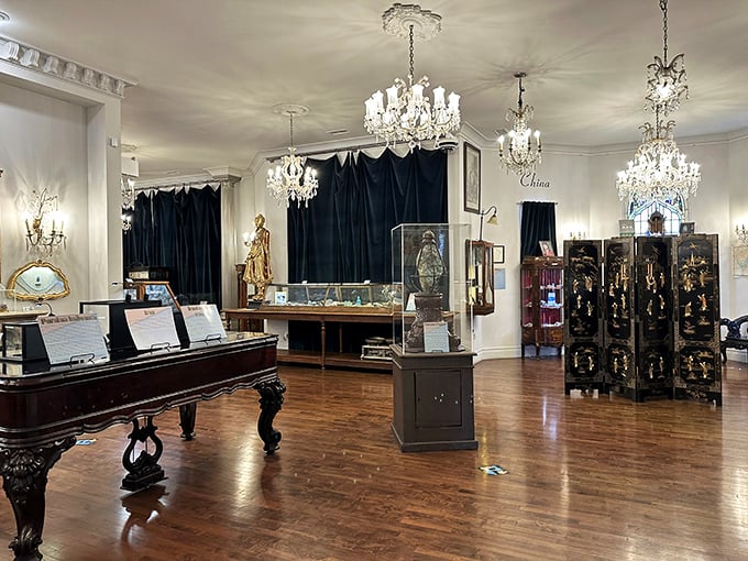 Chandeliers and display cases create a sophisticated atmosphere where visitors can explore the global significance of turquoise across different cultures and time periods.