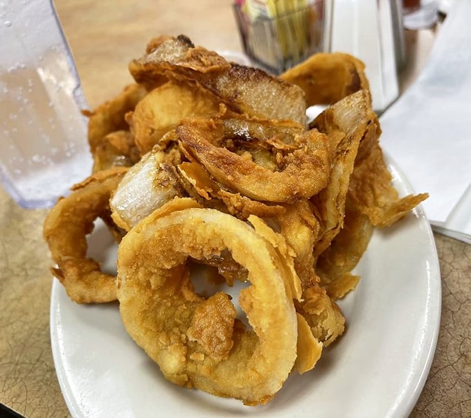 Onion rings so perfectly golden and crisp, they deserve their own fan club and commemorative t-shirt.