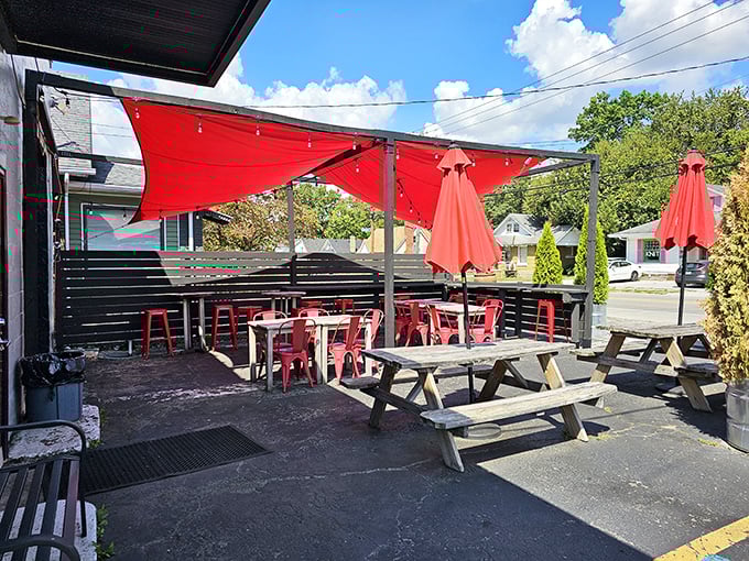The outdoor patio&mdash;where food comas happen under cheerful red sails. Kentucky sunshine and comfort food make this spot the perfect urban oasis.