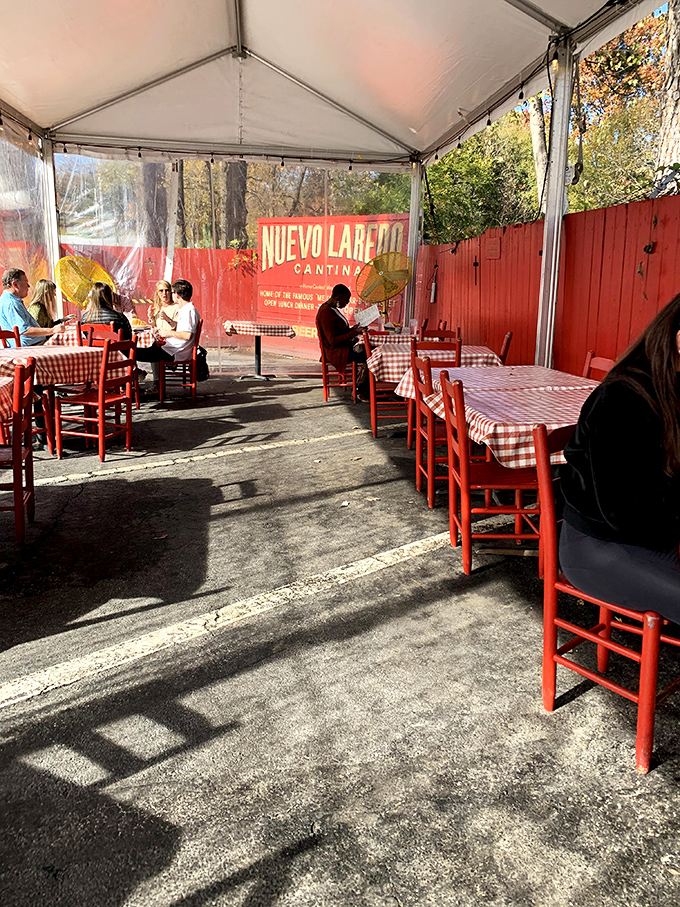 The outdoor dining area offers the same no-frills authenticity as inside&mdash;red chairs, checkered tablecloths, and the promise of Mexican culinary magic under Atlanta skies.