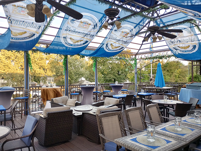 The outdoor beer garden: where summer afternoons go to achieve their highest purpose under blue and white Bavarian skies.