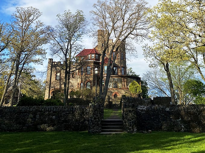 Morning light bathes the castle in a golden glow, revealing the impressive stonework that has stood the test of time like a medieval fortress in suburbia.