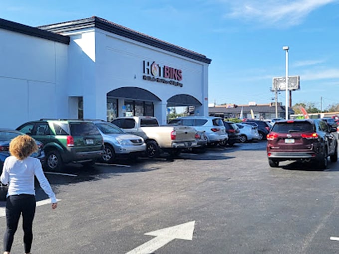 The packed parking lot tells the story before you even enter. Like tailgating for deals, these shoppers come prepared for a full day of treasure hunting.