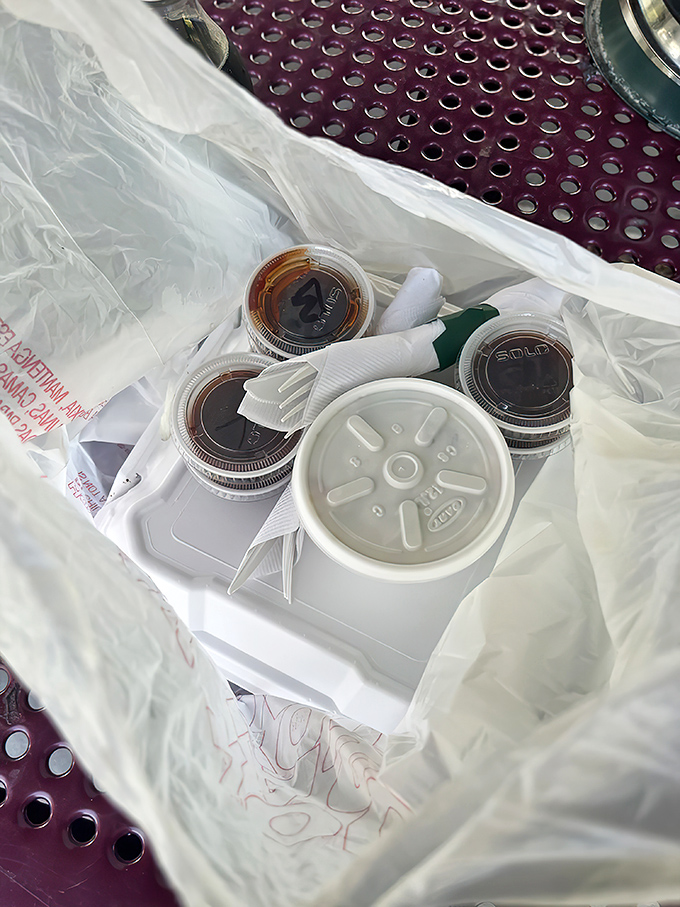 Barbecue to-go: the gift that keeps on giving. Those sauce containers hold liquid gold worth protecting on the drive home.