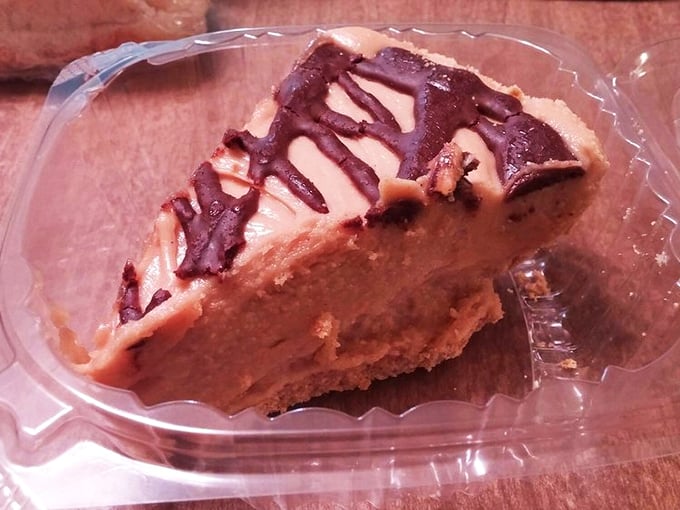 The legendary peanut butter pie with chocolate drizzle&mdash;a dessert so good it makes grown adults contemplate licking the container when no one's looking.