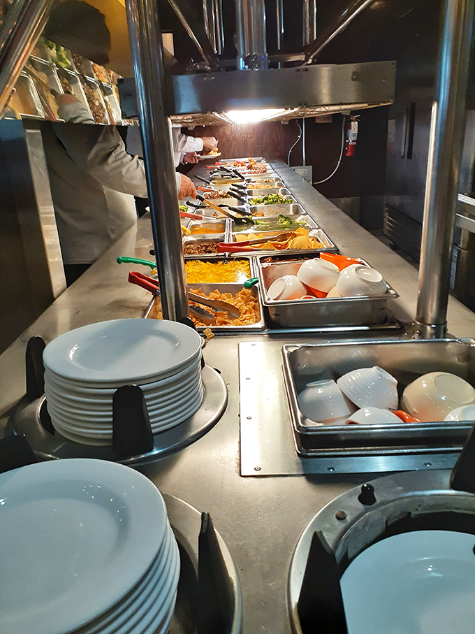 Clean plates stacked and ready for action. In buffet mathematics, this is what unlimited potential looks like.