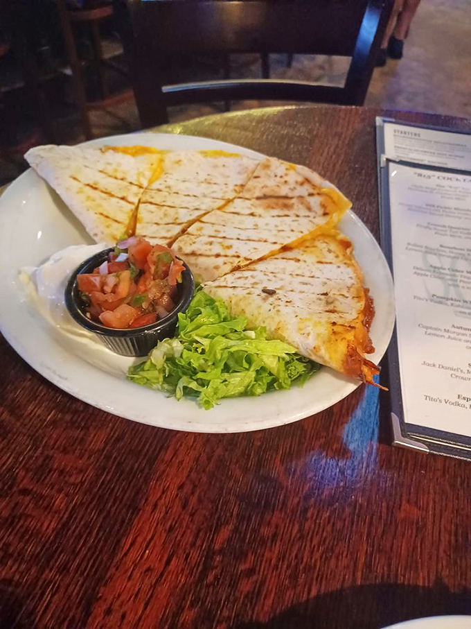 House-made pickles that glow with a turmeric-yellow brilliance&mdash;tangy, sweet, and the perfect palate cleanser between bites of Southern richness. 
