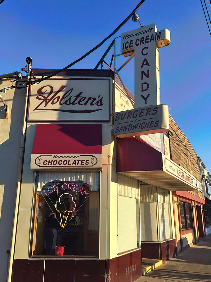 The neon ice cream cone sign might as well say "Abandon all diets, ye who enter here." A beacon of sweet comfort.
