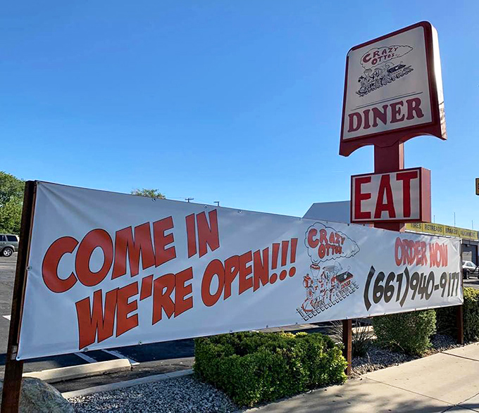 The classic roadside welcome that promises salvation for hungry travelers. Crazy Otto's "COME IN WE'RE OPEN" banner is the breakfast equivalent of a lighthouse beacon.