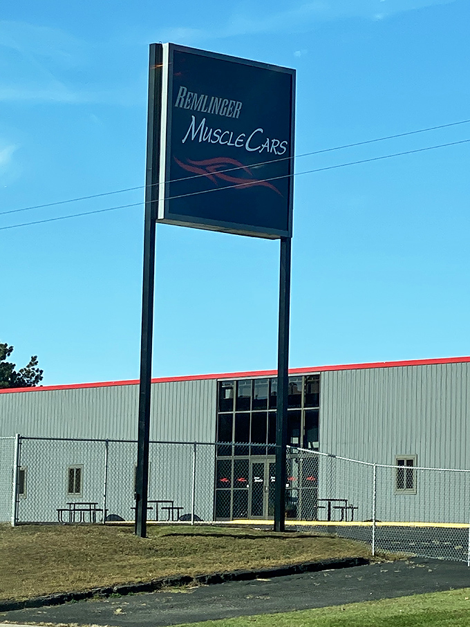 The sign says "Muscle Cars" but what it really means is "Prepare to Relive Your Youth." This unassuming building houses automotive dreams that never went out of style.