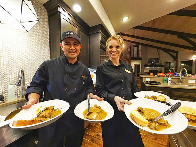 The passionate team behind the magic, proudly displaying plates that will soon become someone's favorite meal memory.