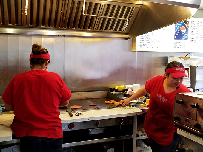 Behind the scenes, the kitchen crew works their magic with practiced efficiency&mdash;the unsung heroes of your burger happiness.