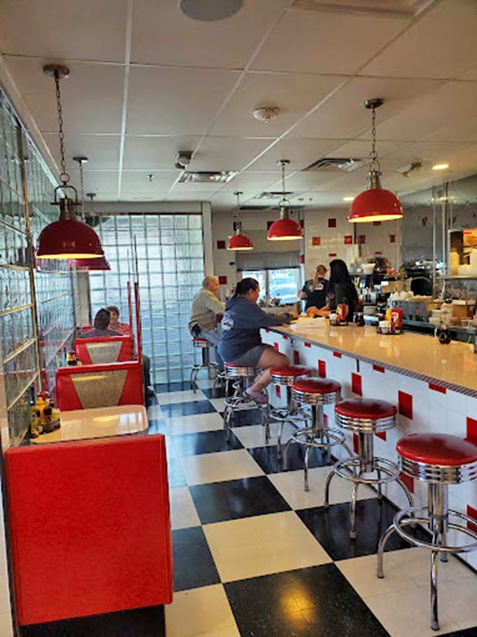 The counter experience: where regulars become family and newcomers quickly learn that a seat at the bar means front-row tickets to the short-order symphony.