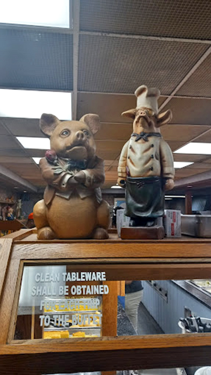 Whimsical pig chef figurines standing guard over the serving area &ndash; the unofficial mascots of food that's anything but plain.