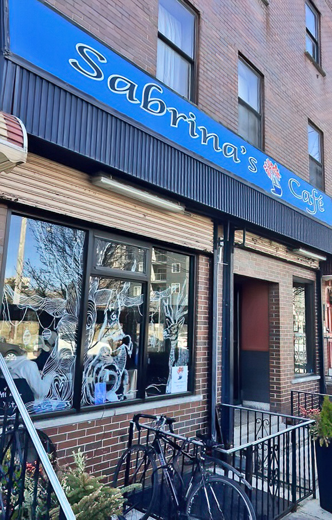 The storefront's artistic window displays serve as a preview of the creativity that awaits on your plate inside.