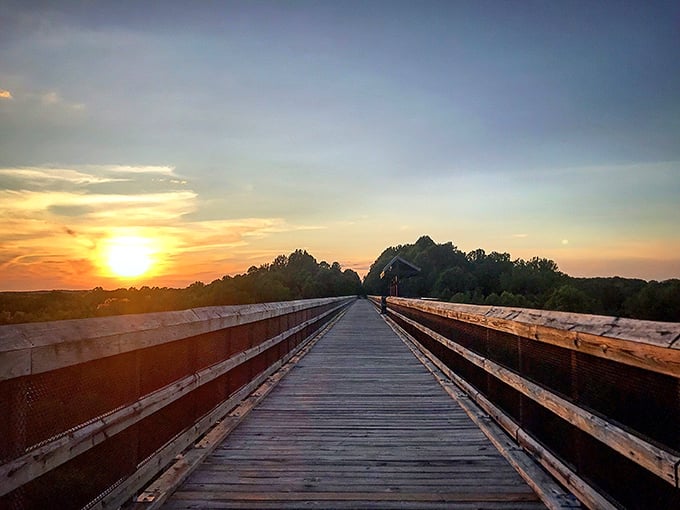 Sunset on High Bridge offers the kind of view that makes smartphone cameras feel wholly inadequate—like trying to capture the Grand Canyon with a flip phone.