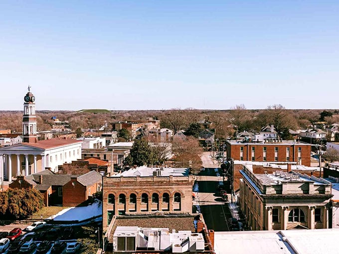 Petersburg unfolds like a living history book from above. Church spires punctuate a skyline where centuries of architecture create a uniquely American small-town panorama.