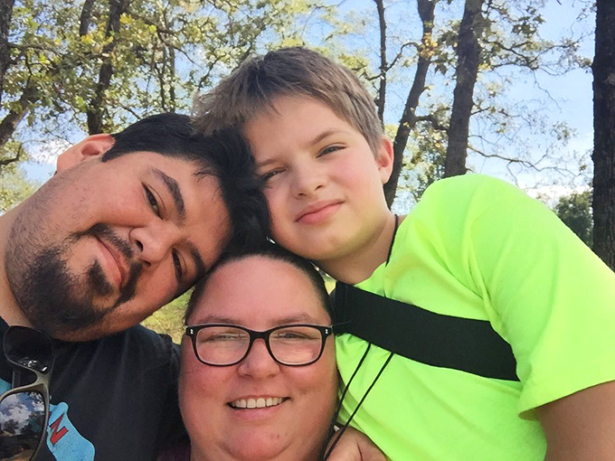 Park visitors enjoying the natural beauty that makes Natural Falls a perfect backdrop for creating lasting family memories.