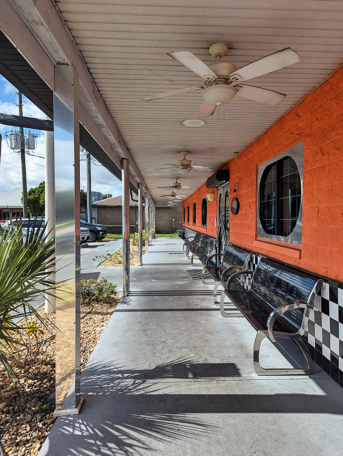 The covered walkway isn't just practical&mdash;it's where anticipation builds as you approach those checkered walls, knowing comfort food awaits just beyond the door.