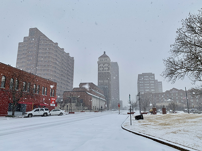 Downtown Bartlesville under a blanket of snow transforms into a winter wonderland, where those distinctive towers pierce a cotton-candy sky.