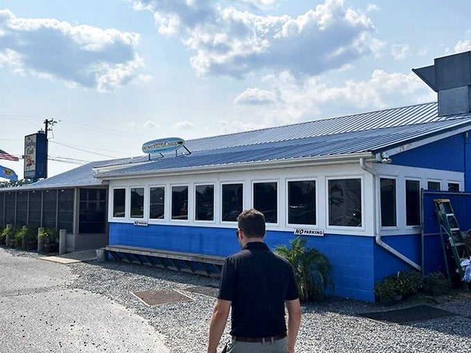 The blue facade of The Surfing Crab stands like a seaside sanctuary calling to hungry souls and promising delicious ocean treasures within.